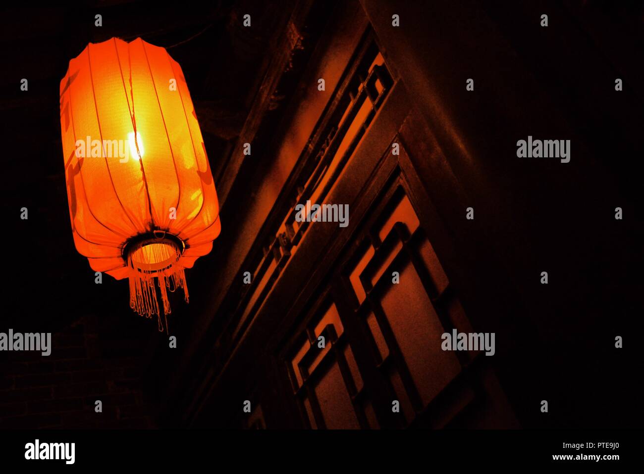 traditional historical chinese village, buildings with lanterns at dawn ...