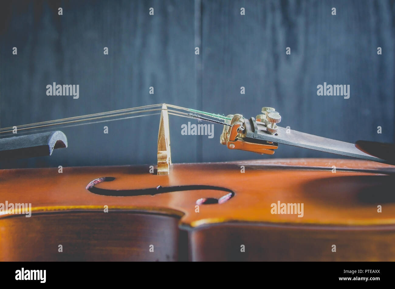 The violin on the dark table, Close - up of violin on the wooden floor ...