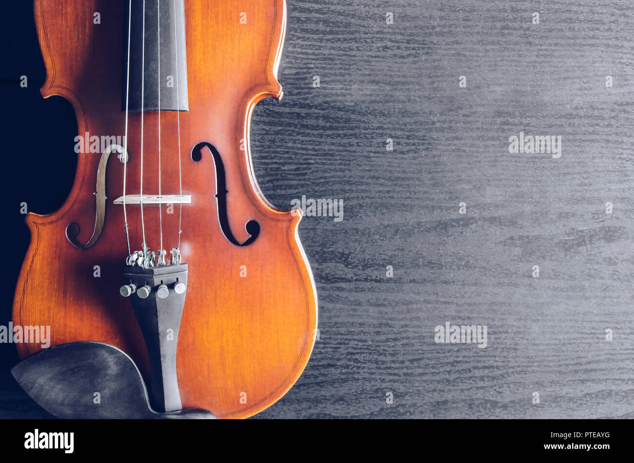 The violin on the dark table, Close - up of violin on the wooden floor ...