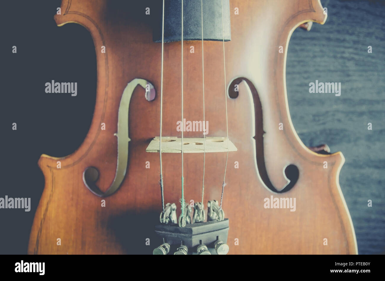 The violin on the dark table, Close - up of violin on the wooden floor ...