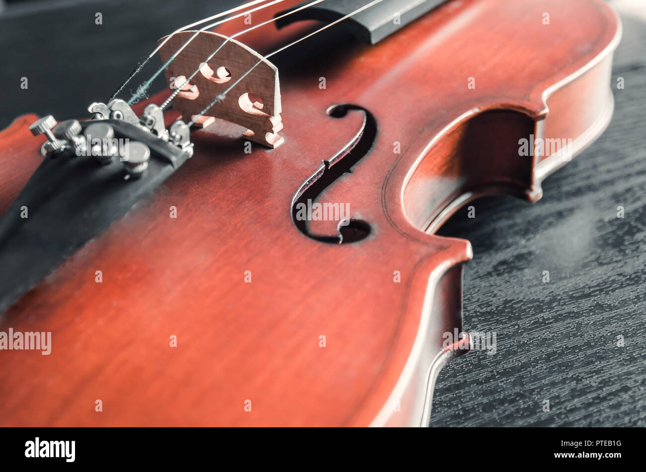 The violin on the dark table, Close - up of violin on the wooden floor ...