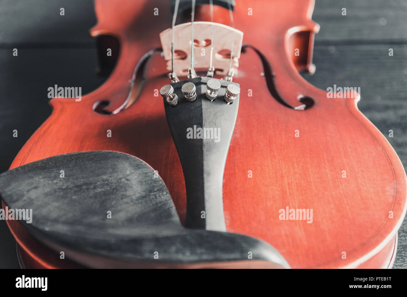 The violin on the dark table, Close - up of violin on the wooden floor ...
