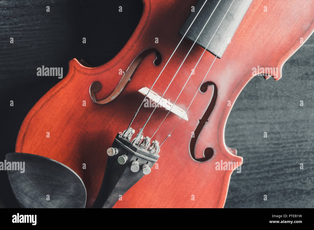 The violin on the dark table, Close - up of violin on the wooden floor ...