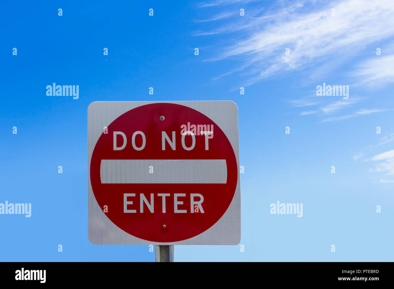 Do not enter sign on blue sky background Stock Photo - Alamy