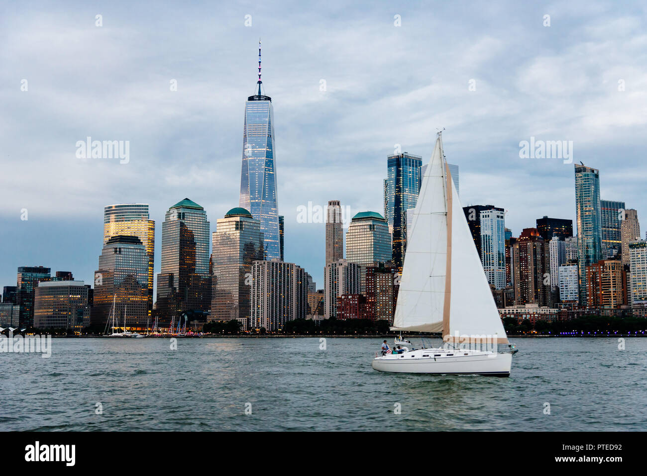 Sailing boat against skyline of Downtown of Manhattan in New York at ...
