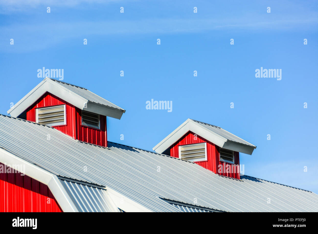 Top roof of red barn on blue sky background Stock Photo - Alamy