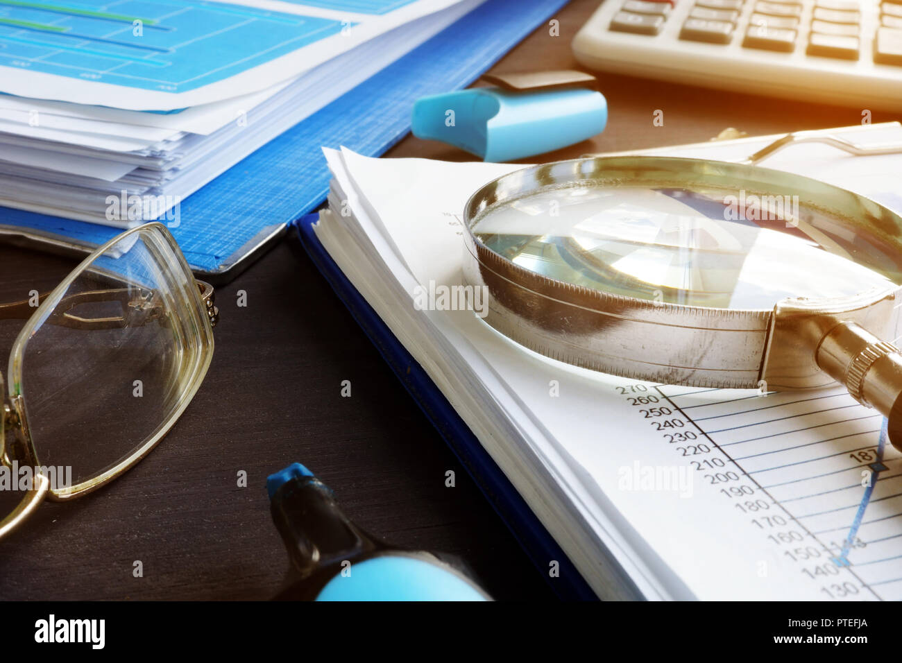 Financial analysis and audit. Magnifying glass and report Stock Photo ...