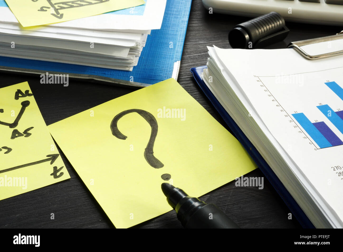 Question mark and financial report. Problems with business Stock Photo ...