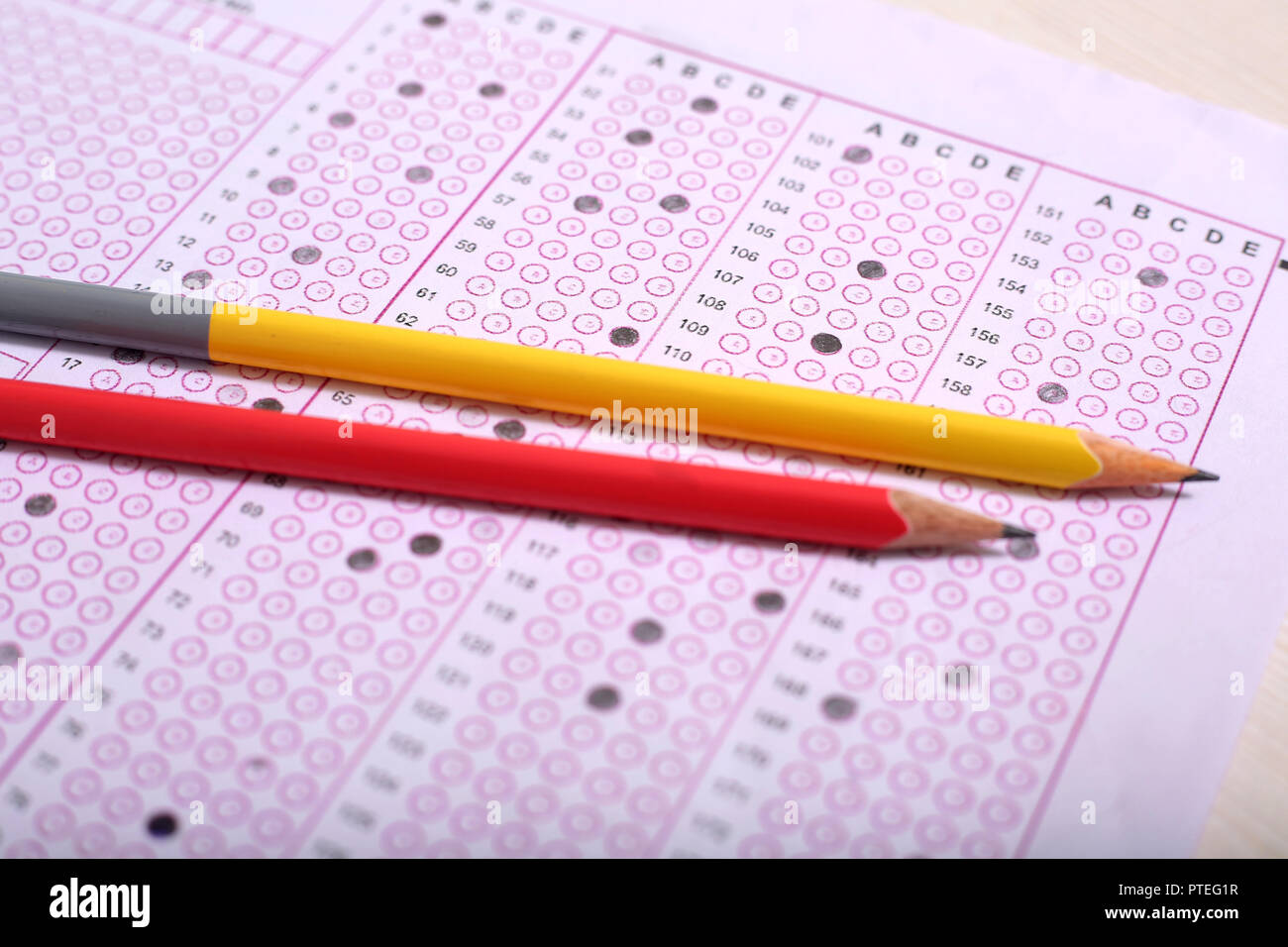 Picture of two pencil on the OMR sheet. Isolated on wooden background ...