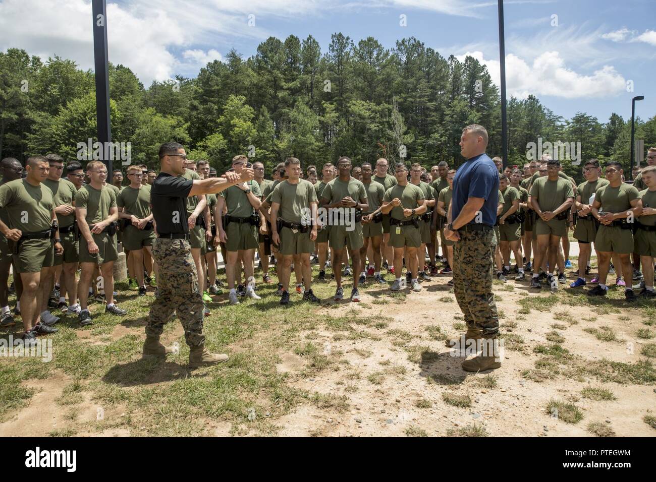 U.S. Marine Corps Gunnery Sgt. Kevin P. Cain, right, demonstrates the ...