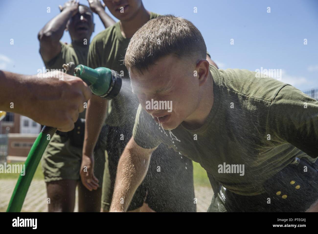 A student attached to Marine Corps Embassy Security Group is sprayed ...