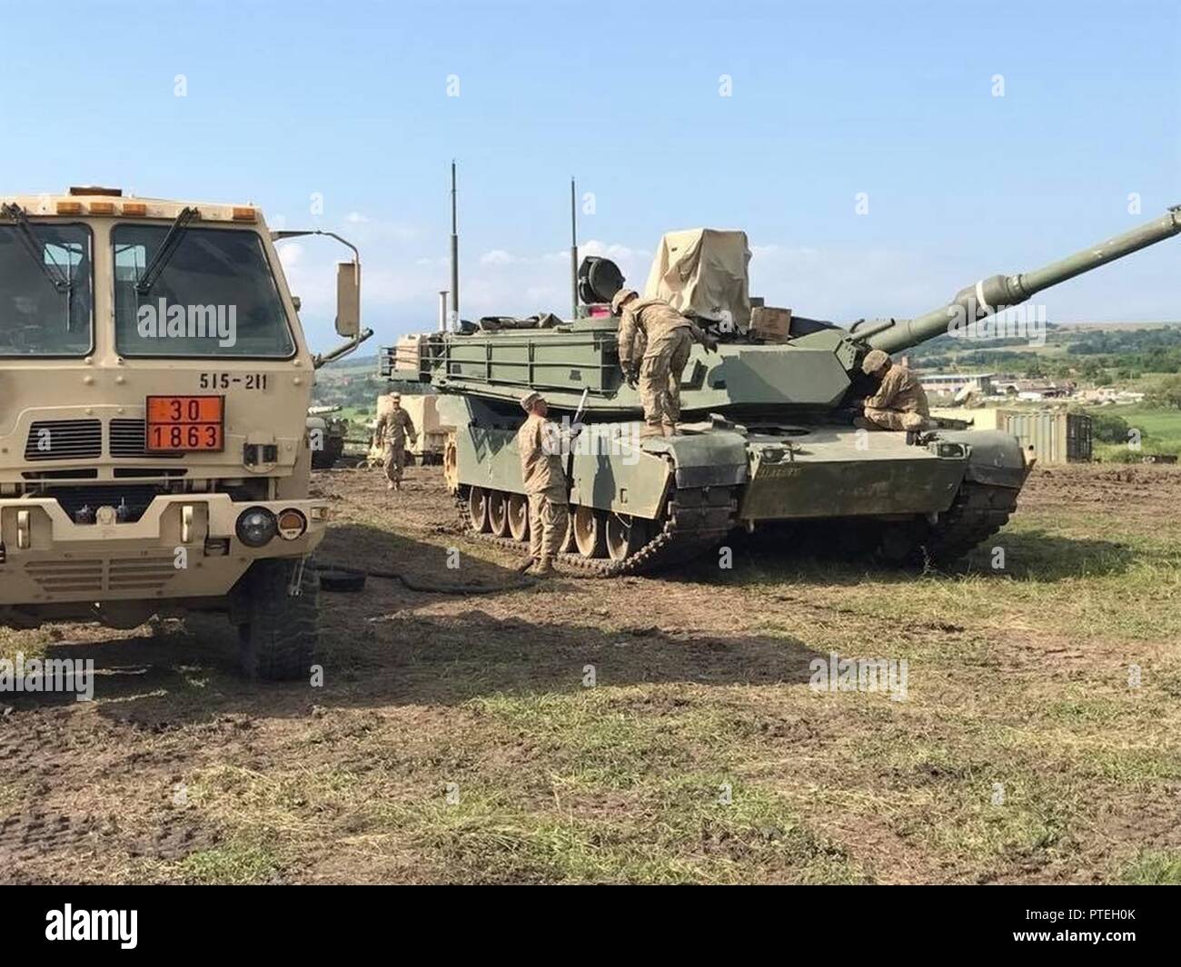 A 325th Transportation Company Soldier keeps an M1 Abrams tank on the ...