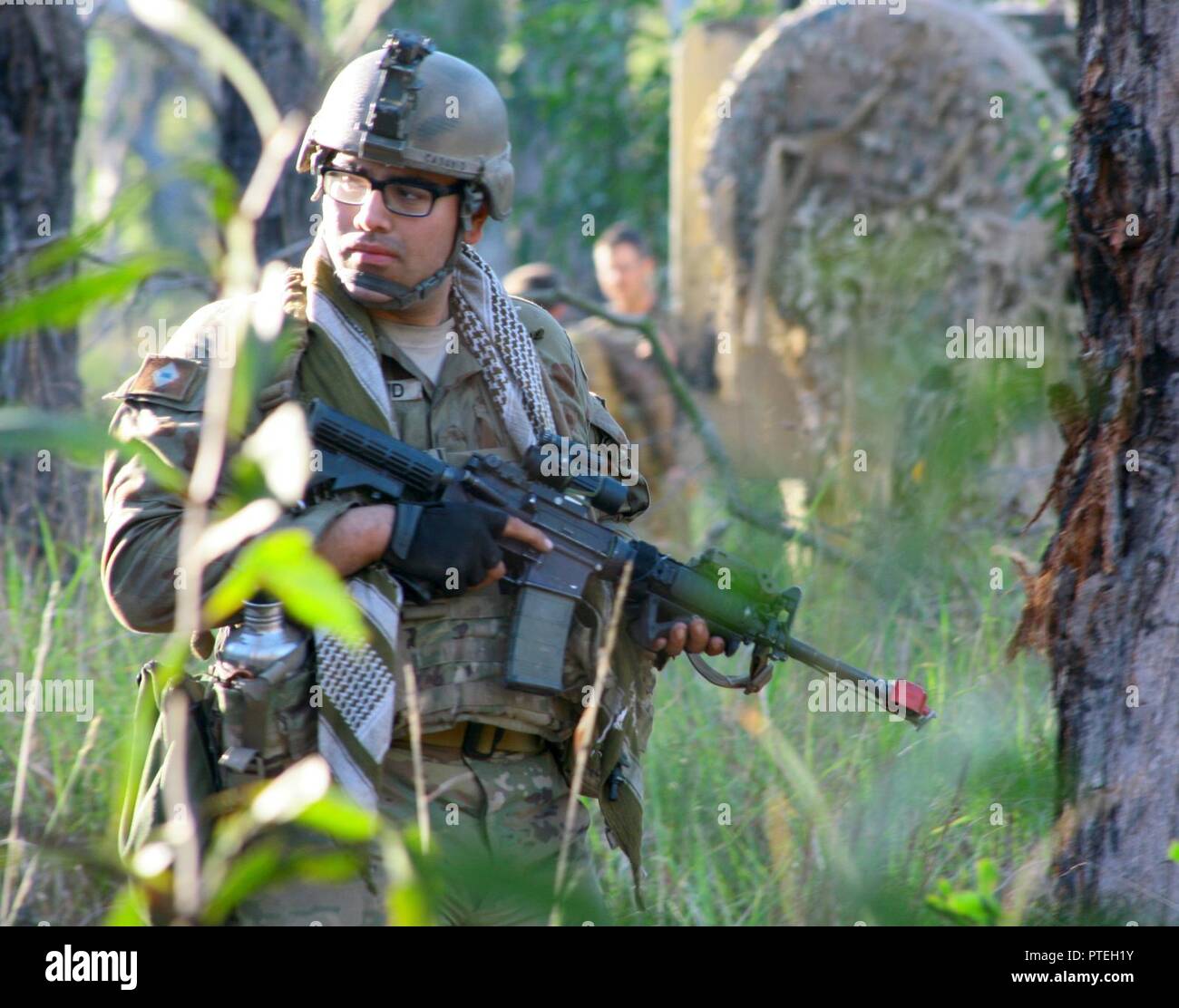 Spc. Mario Cadavid, an infantryman assigned to Headquarters and ...