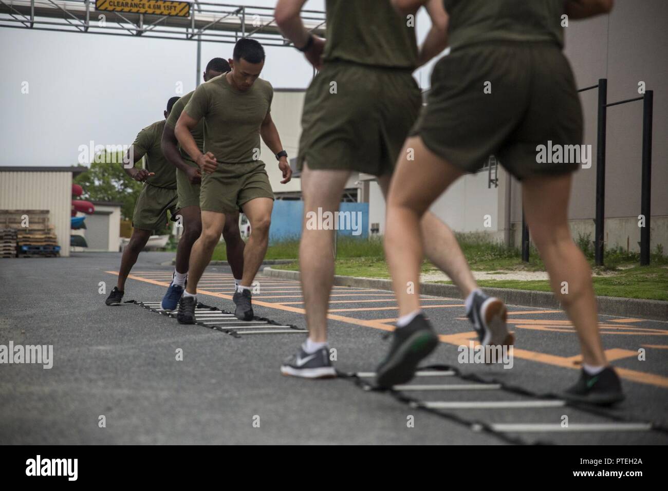U.S. Marines with Marine Aircraft Group 12 perform an agility drill ...