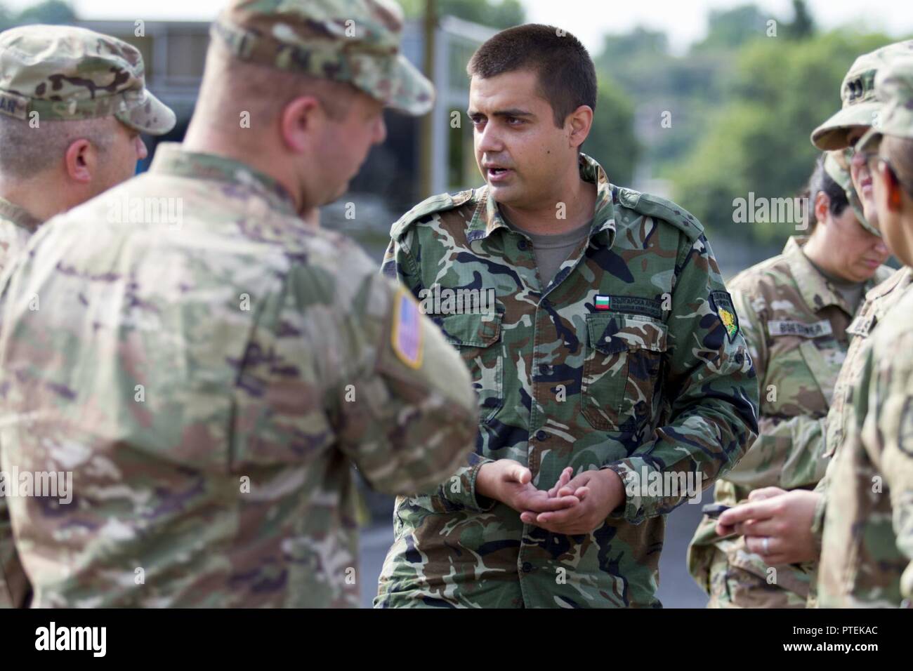 A Bulgarian Civil Military Cooperation partner speaks with soldiers ...