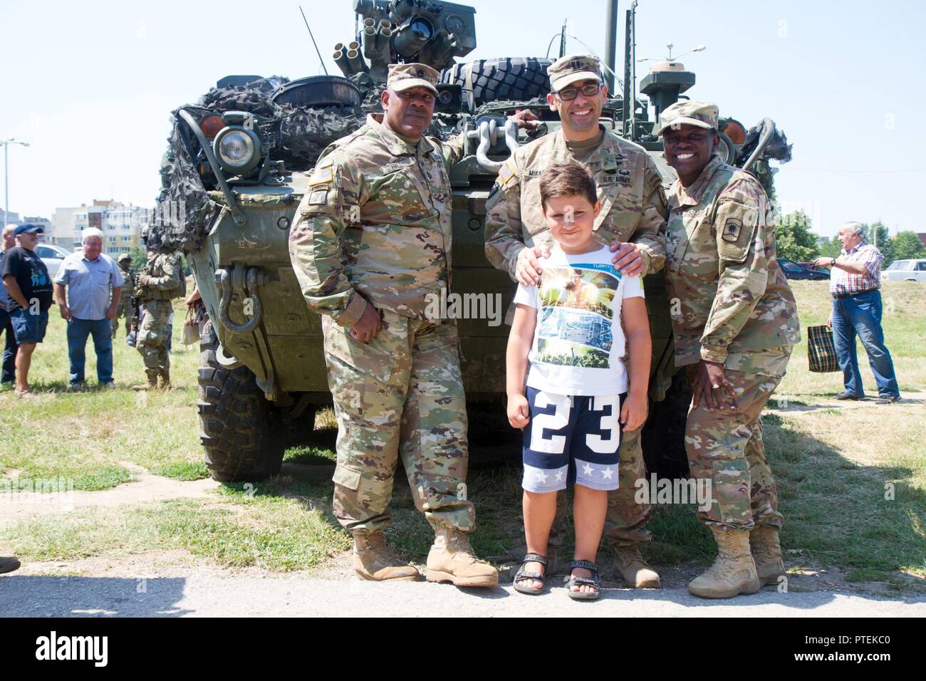 Soldiers of 361st Civil Affairs Brigade pose for a photo with locals of ...
