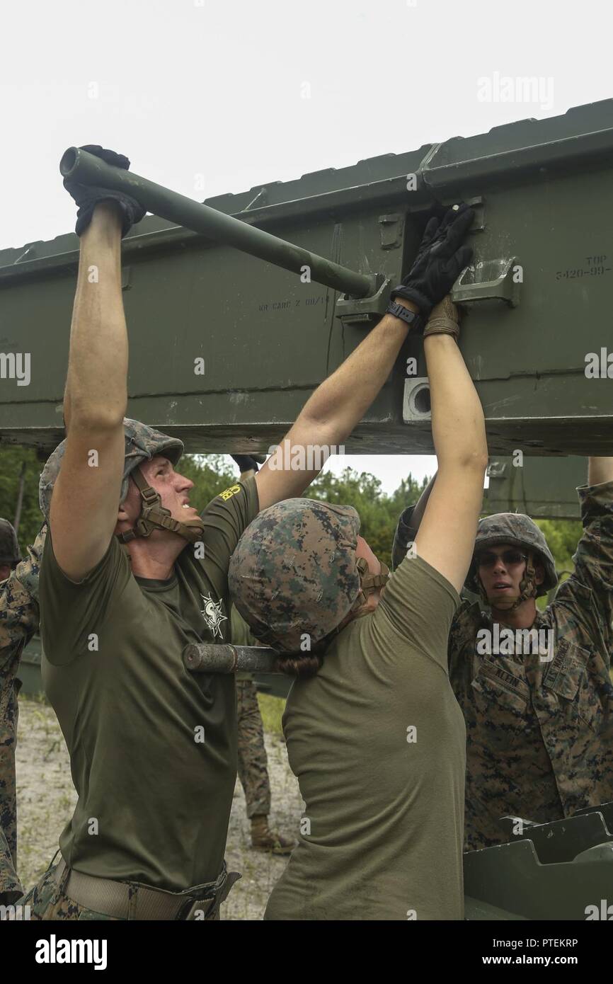 U.S. Marine Corps Lance Cpl. Joshua Higgins, left, Combat Engineer ...