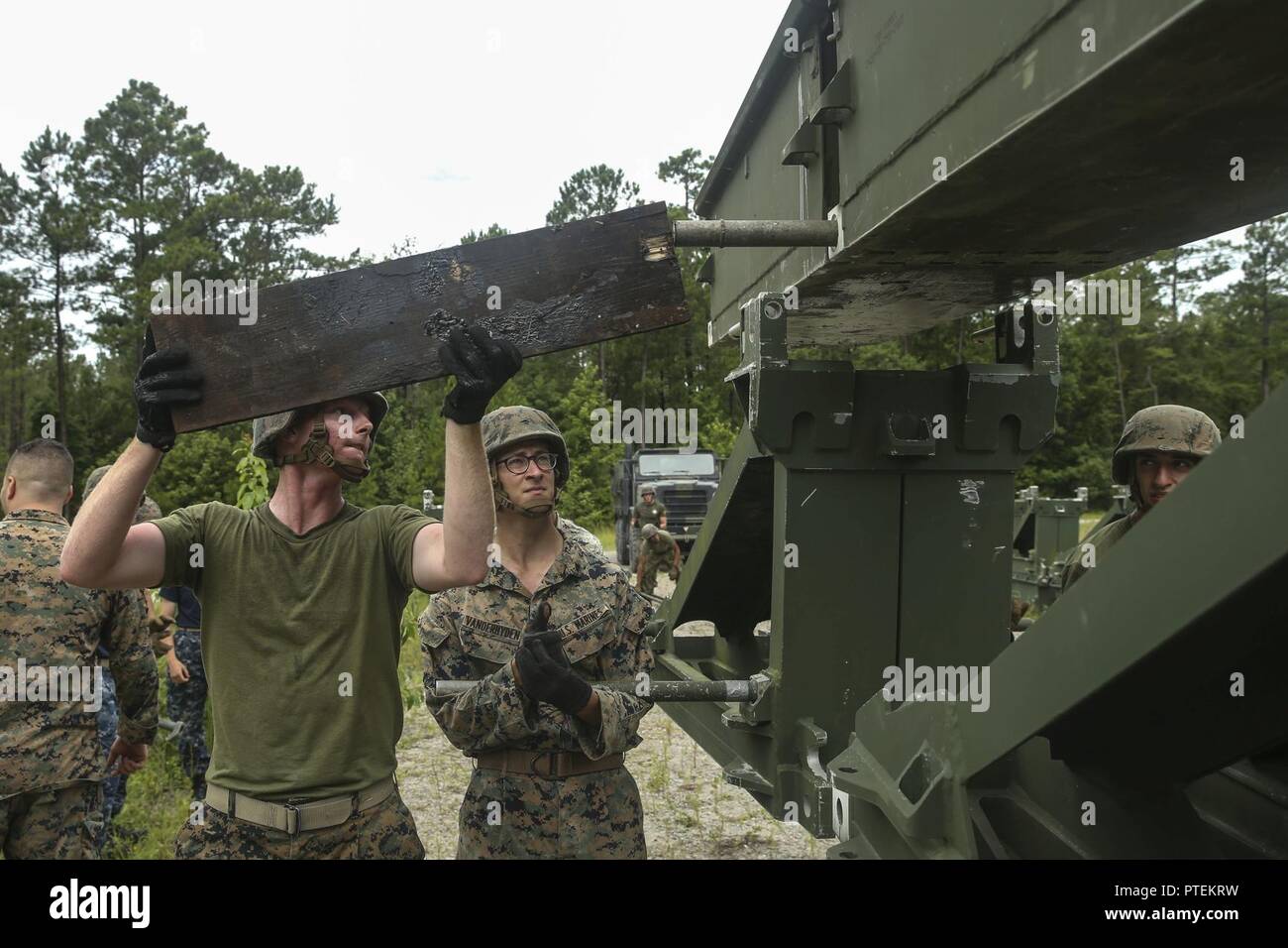 U.S. Marine Corps Lance Cpl. Tyler L. Parker, left, Combat Engineer ...