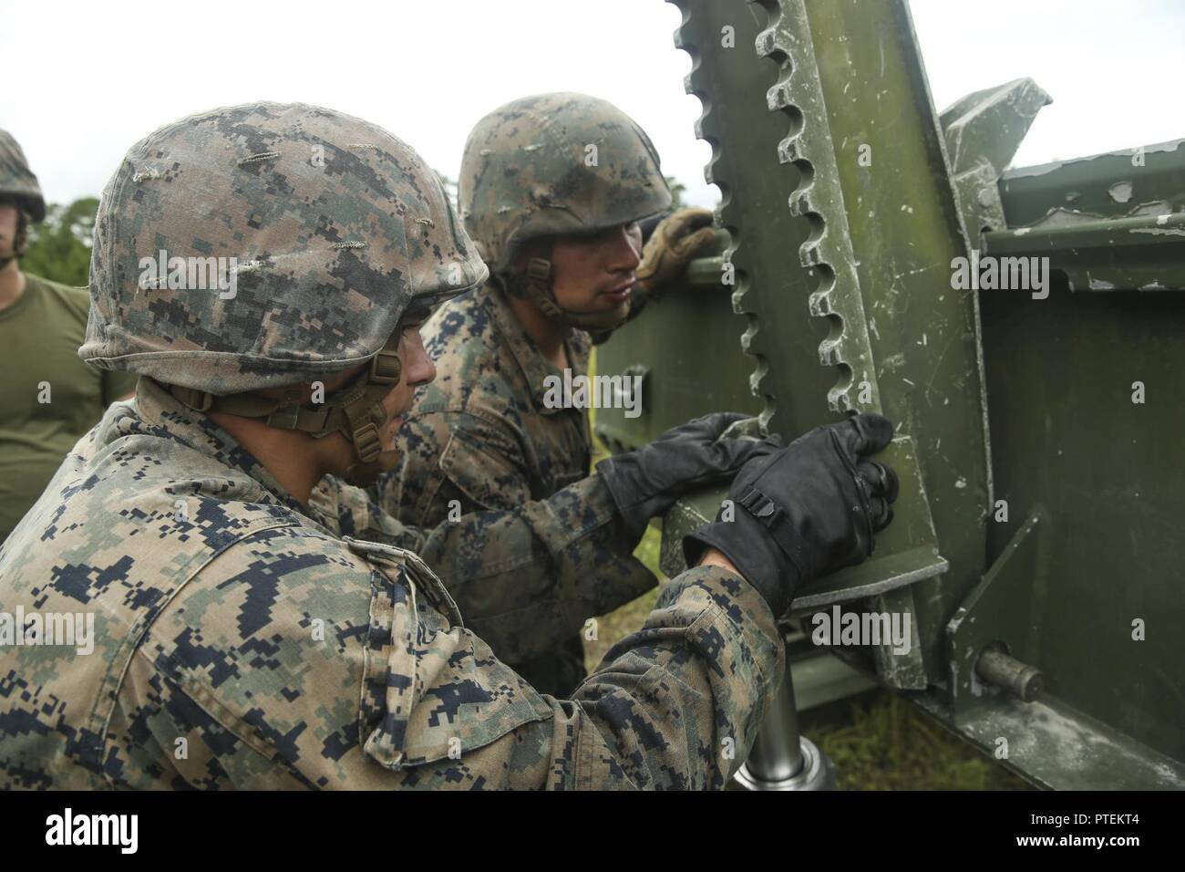 U.S. Marine Corps Lance Cpl. Jose Vegahernandez, left, Combat Engineer ...
