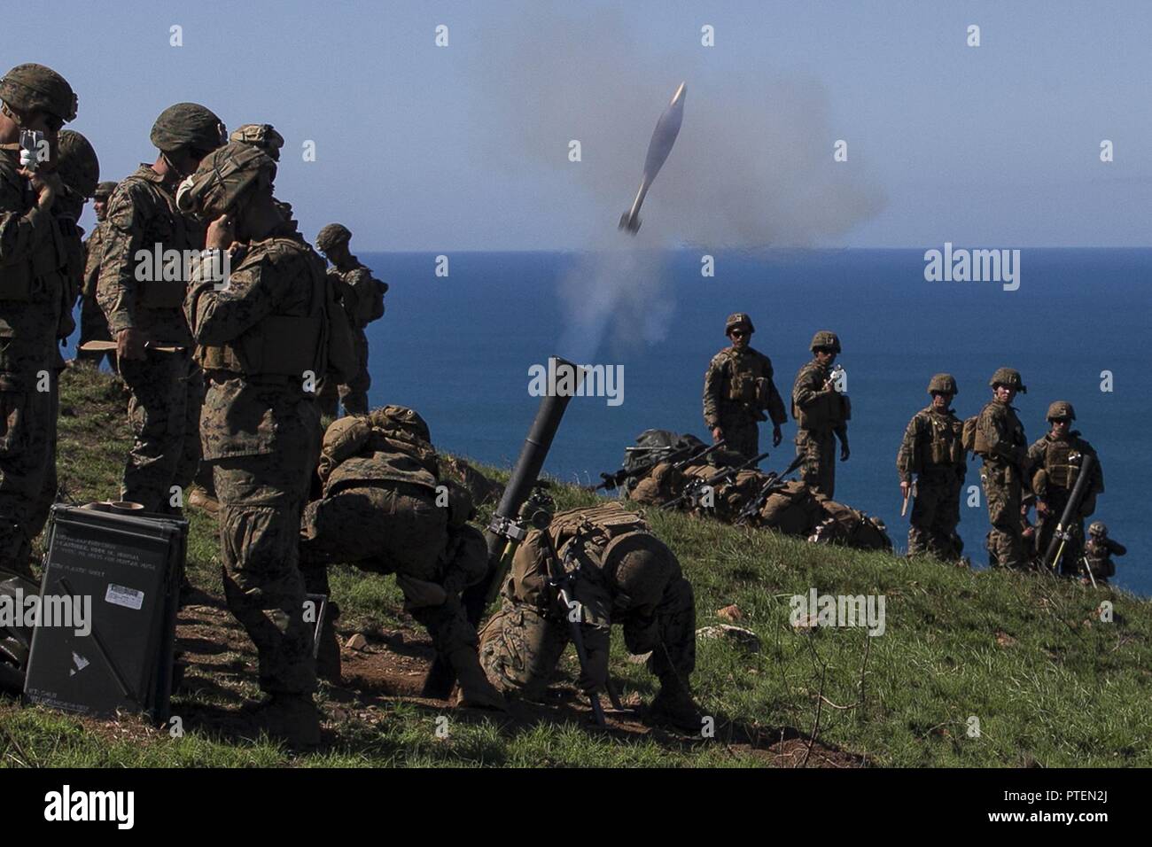 An 81-mm mortar round exits a mortar tube on Townshend Island ...