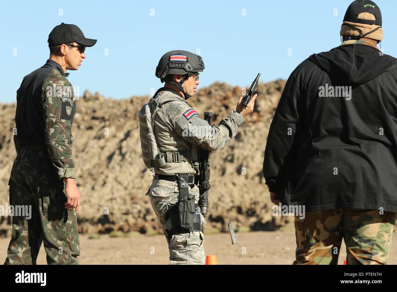 A Costa Rican competitor clears his weapon during the Critical Task ...