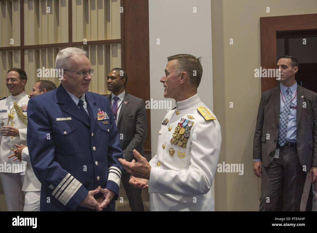 Commandant of the Coast Guard Adm. Paul F. Zukunft, right, speaks with ...