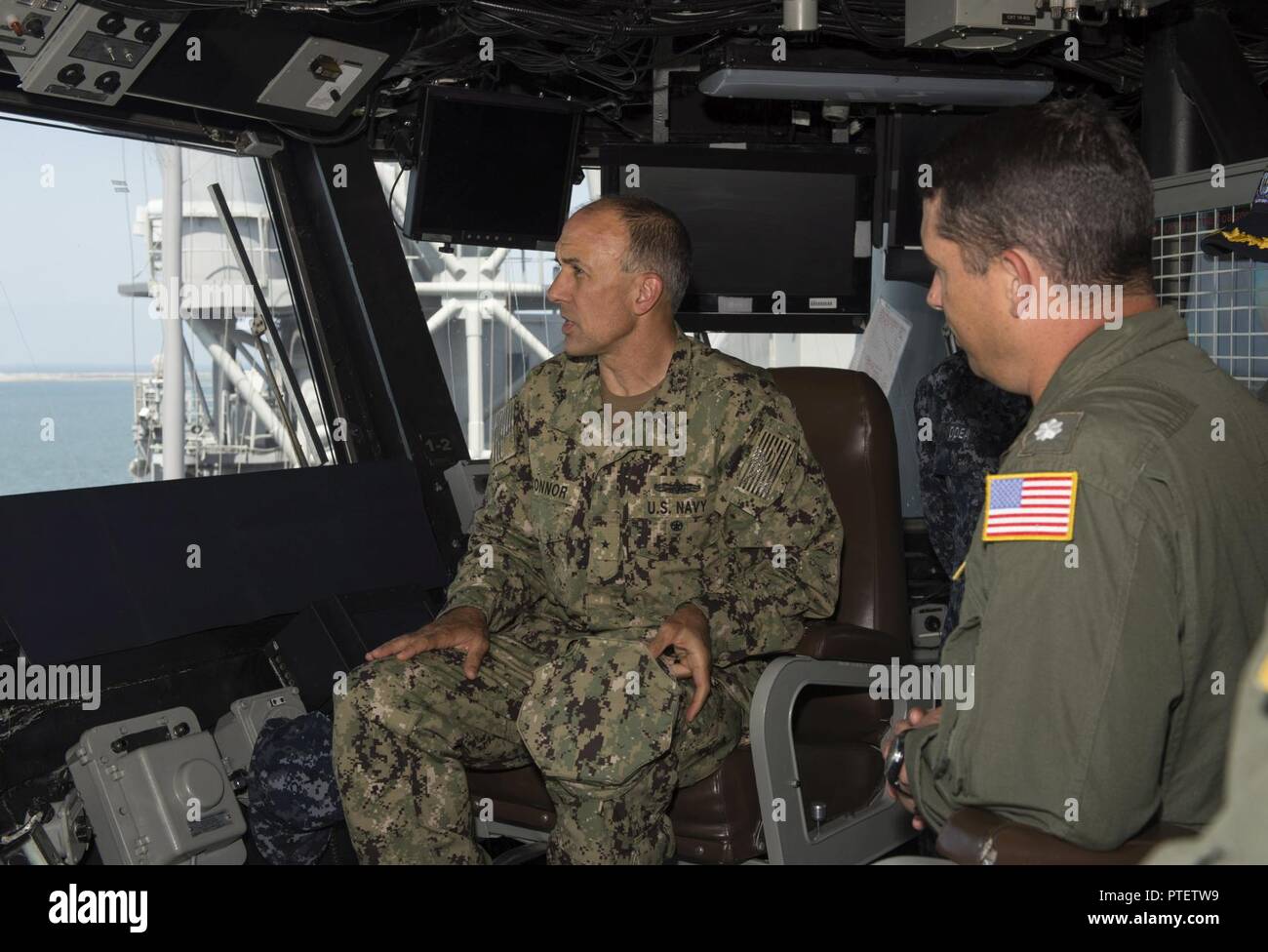 DIEGO (July 18, 2017) Cmdr. Chad Falgout, right, Air Officer aboard the ...