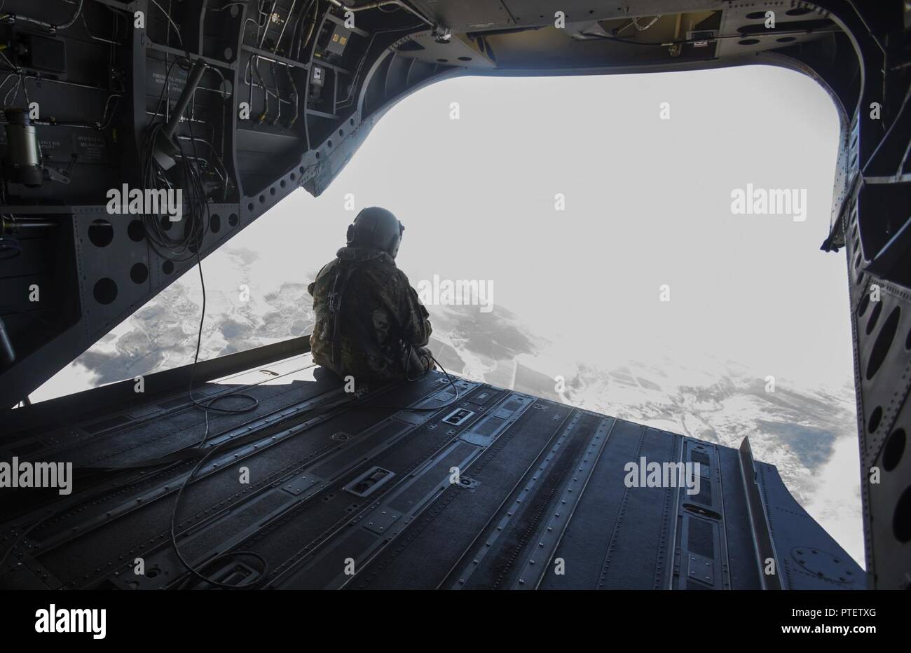SCHOFIELD BARRACKS – A U.S. Army crew chief sits at the edge of a CH-47 ...
