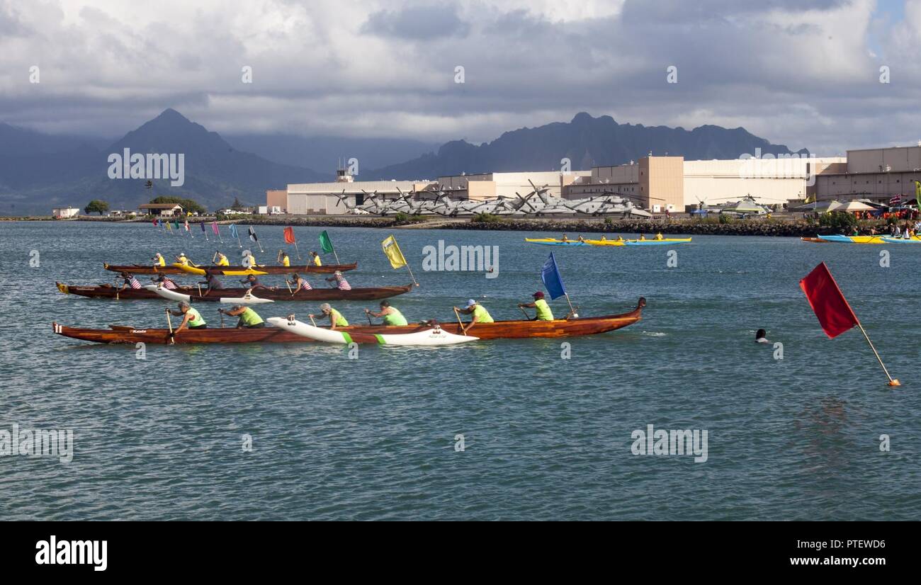 Canoe teams paddle towards the starting line of the “Na Koa Lani” canoe ...