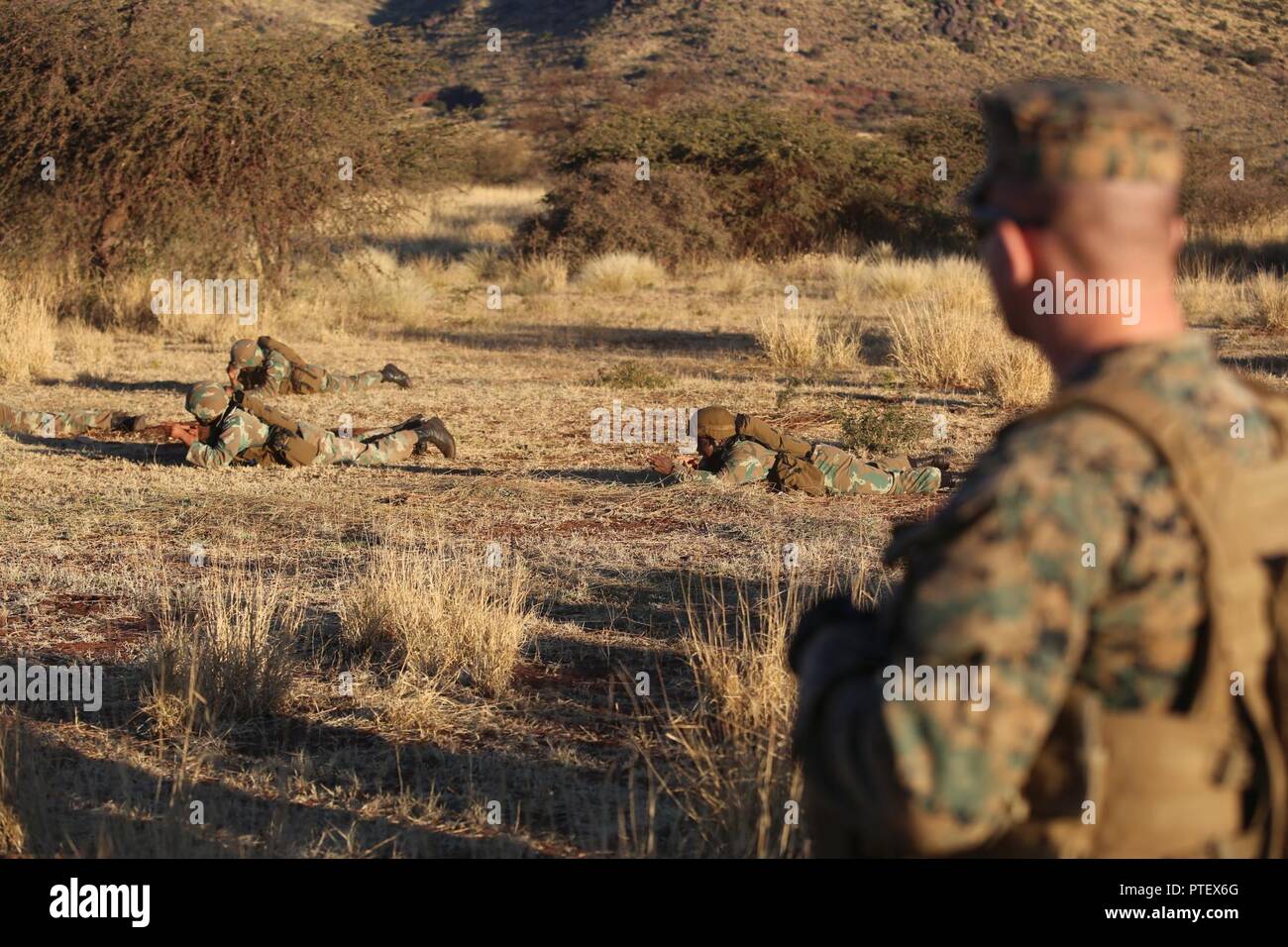 U.S. Marine looks on as his South African Maritime Reaction Squadron ...