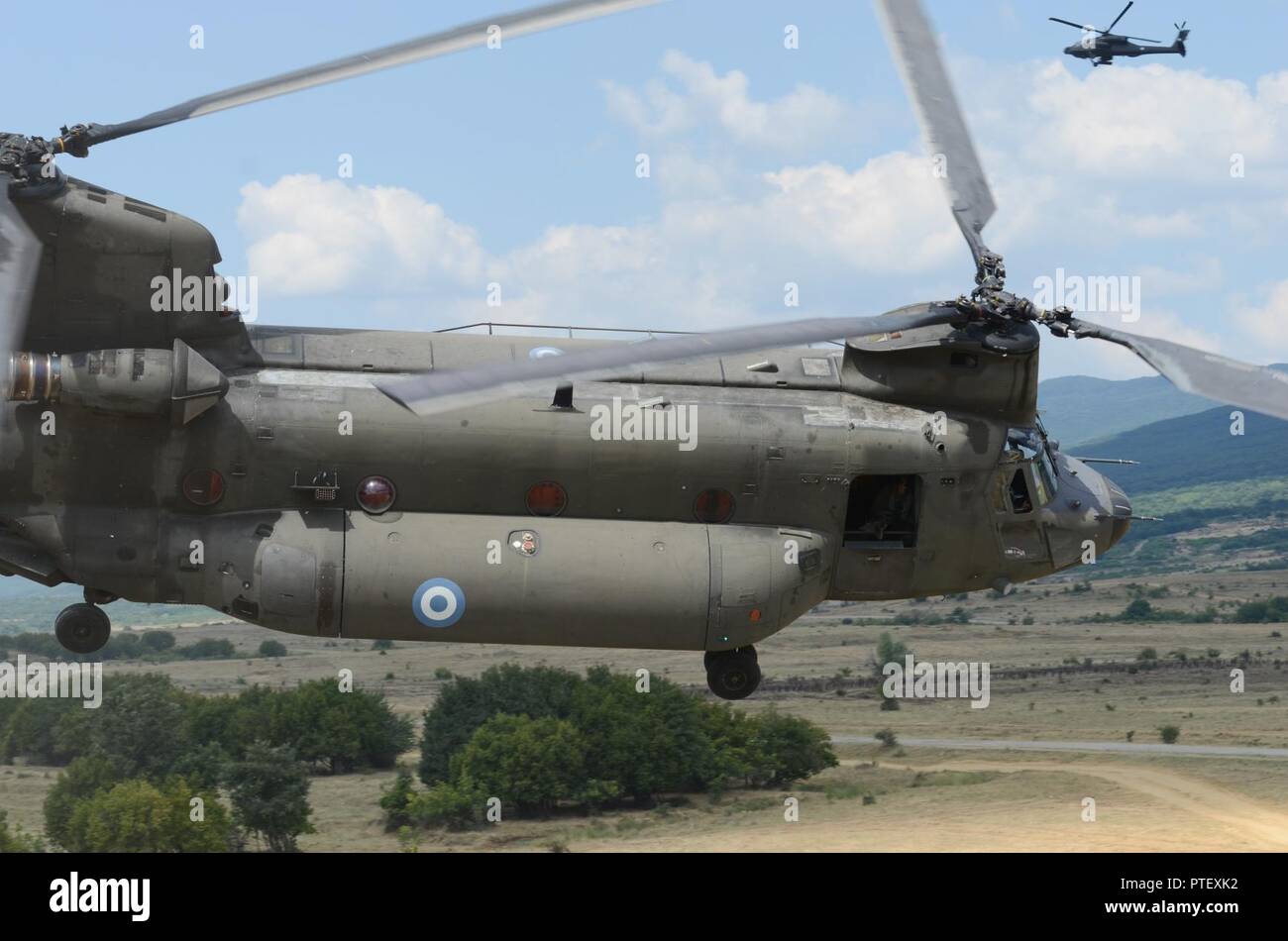 A Greek CH-47 Chinook rotary-wing aircraft and an AH-64 Apache provide ...