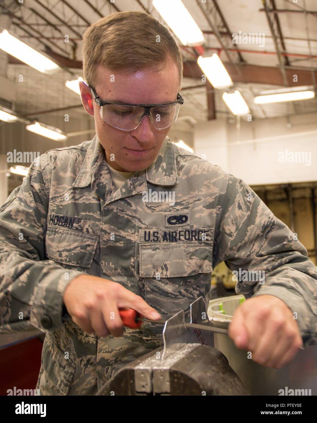 U.S. Air Force Senior Airman Preston Hogan, an aircraft structural ...