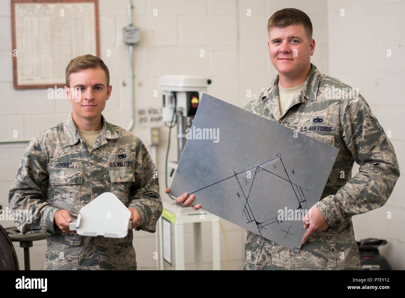 U.S. Air Force Staff Sgt. Anthony McConnell, right, and Senior Airman ...