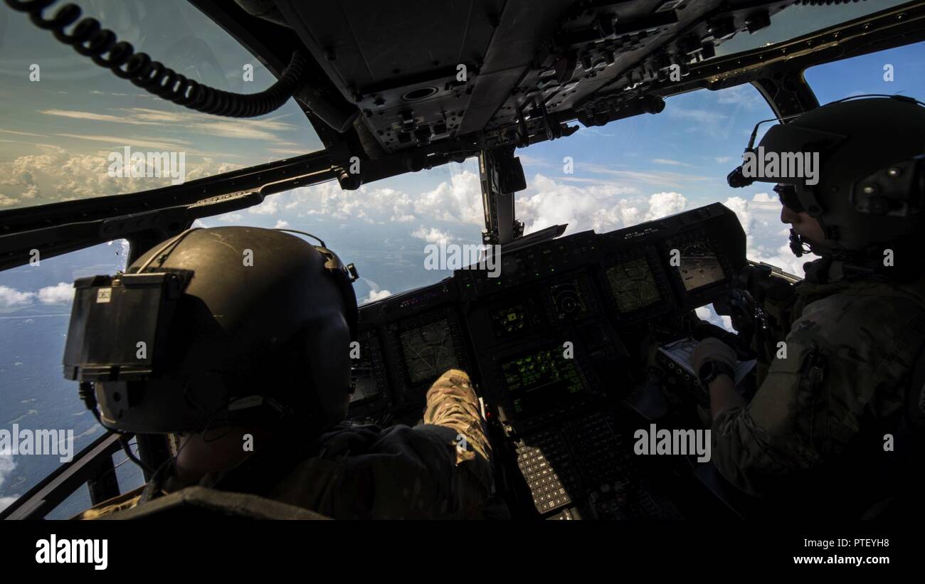 Aircrew with the 8th Special Operations Squadron pilot a CV-22 Osprey ...