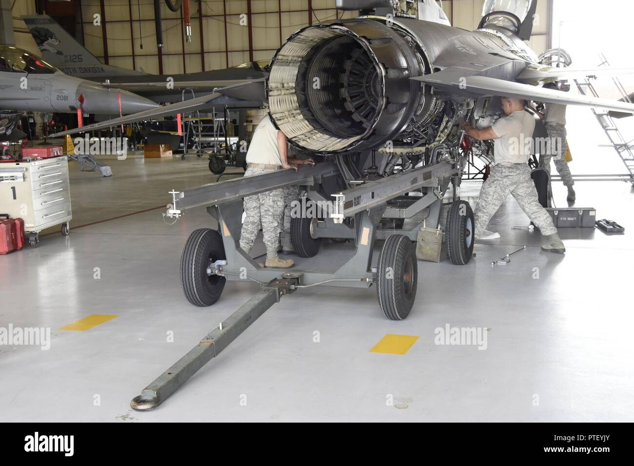 114th Aircraft Maintenance Squadron engine shop Airmen remove the ...