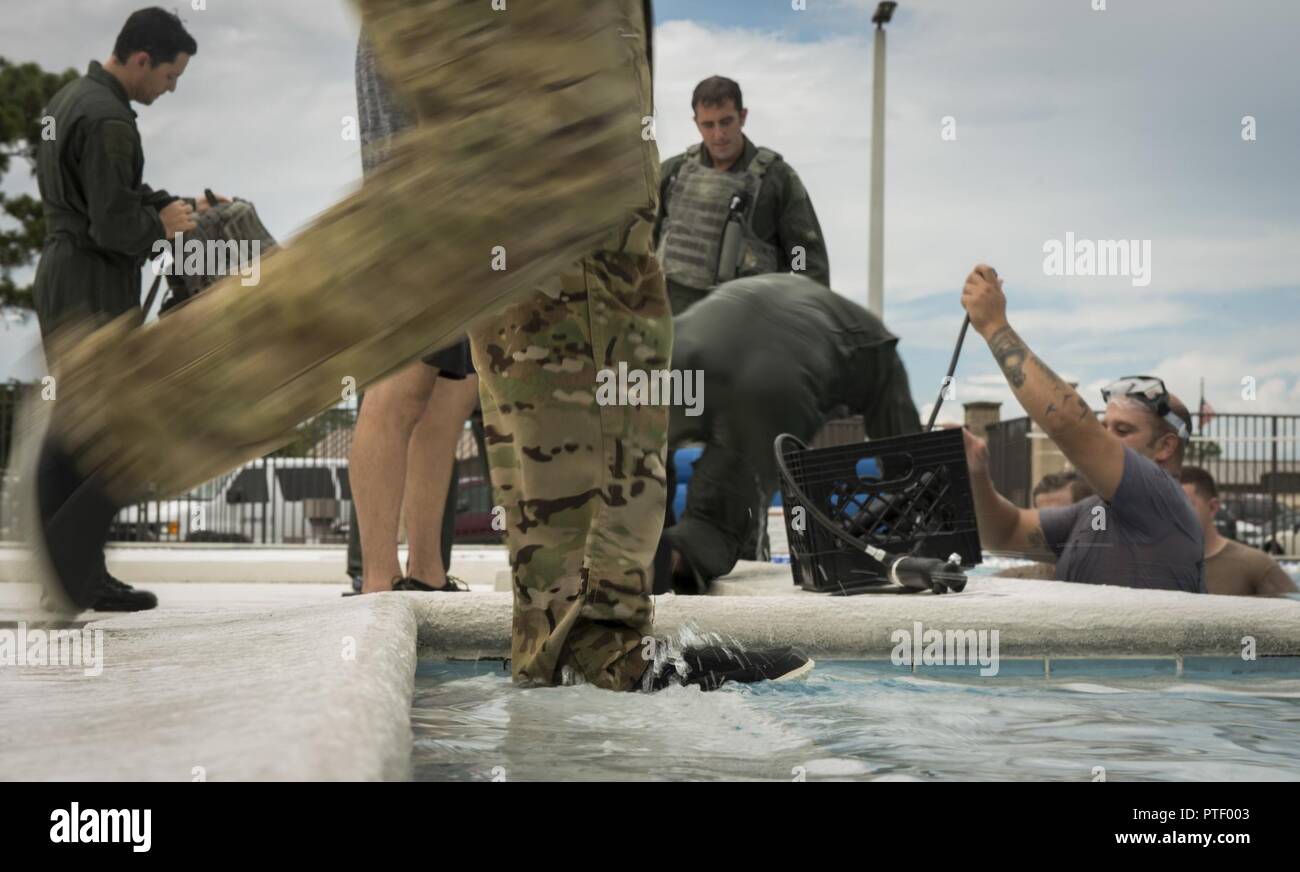 An 8th Special Operations Squadron aircrew member enters the base pool ...