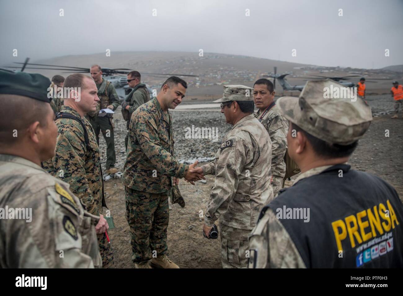 U.S. Marine Gunnery Sgt. Nicolas Trujillo shakes hands with Peruvian ...