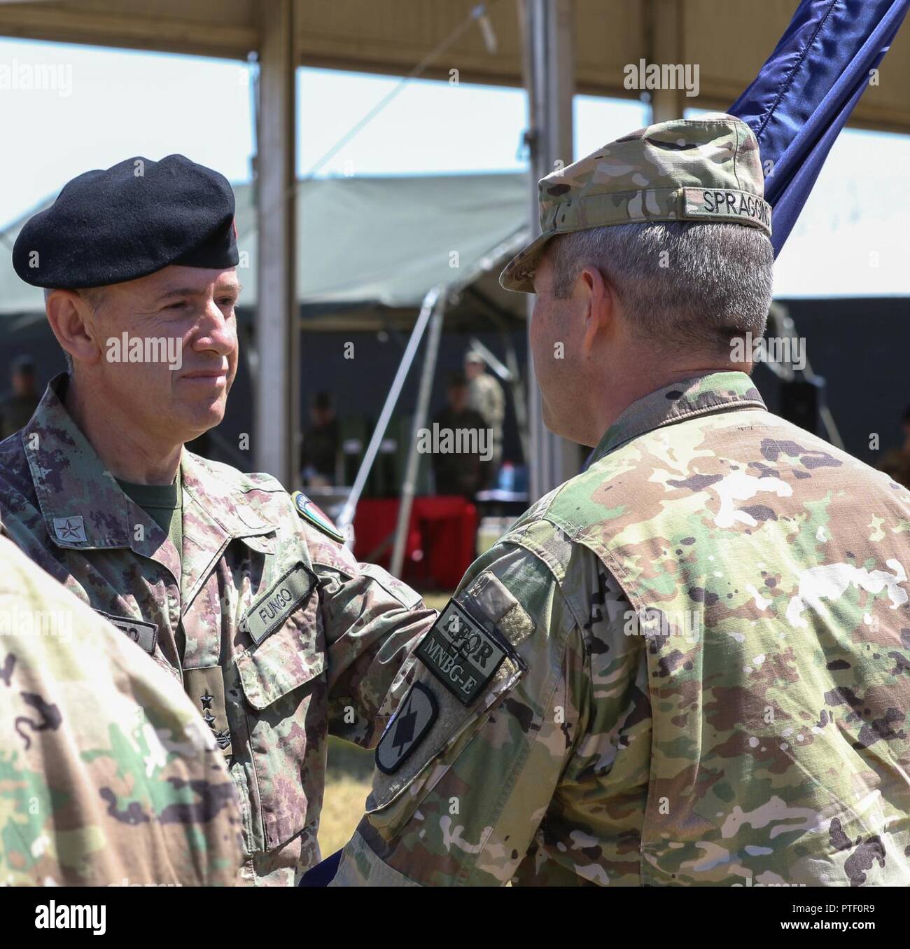 Maj. Gen. Giovanni Fungo, Kosovo Forces commander, hands the NATO flag ...