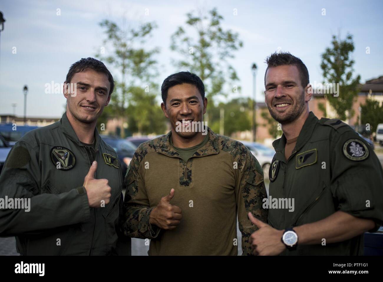 U.S. Marine Corps Master Sgt. Jerry Jordan, center, a jump master ...