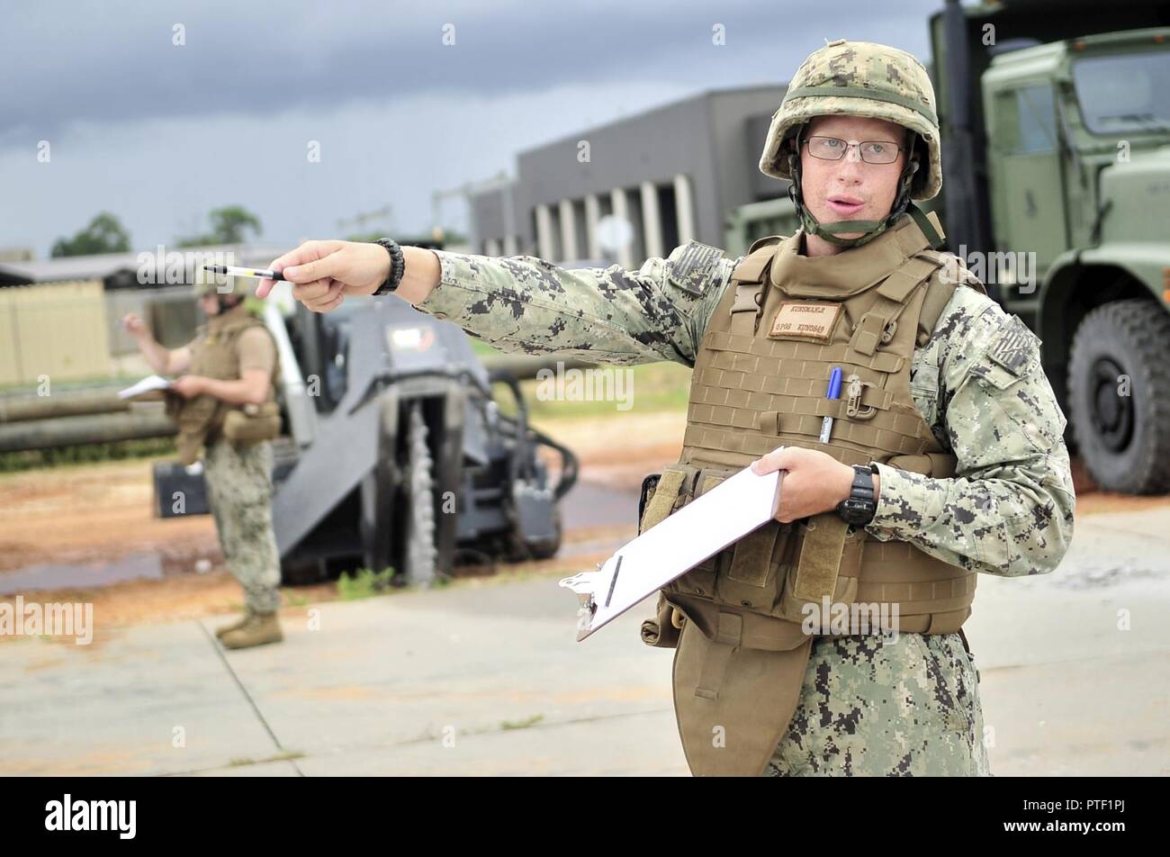 Builder Constructionman Ronald Kunsman, a Seabee assigned to Naval ...