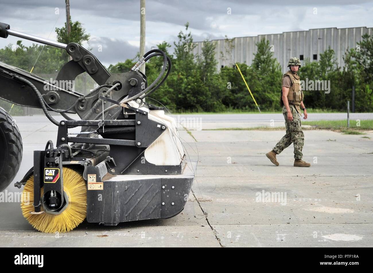 A Seabee assigned to Naval Mobile Construction Battalion (NMCB) 11 ...