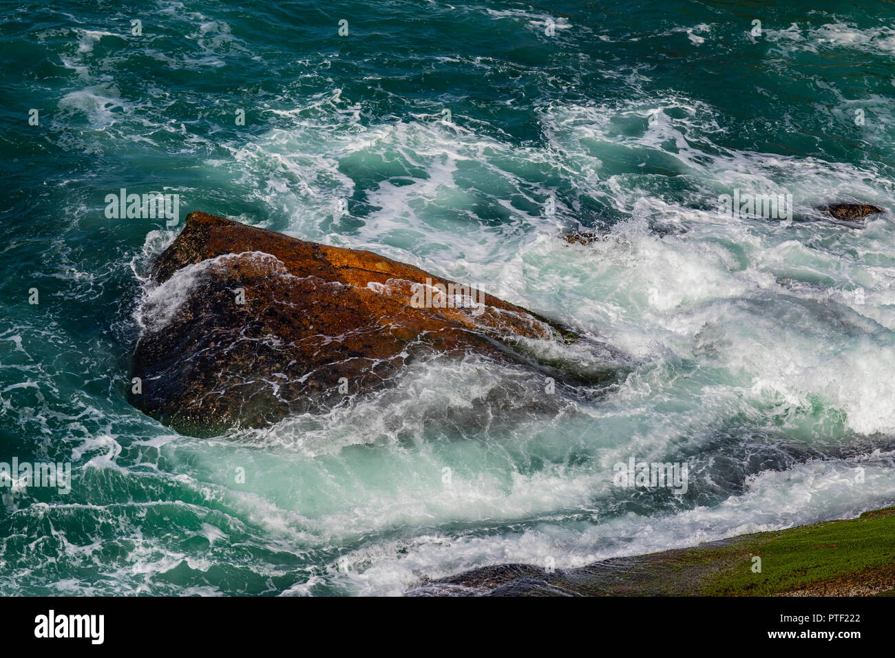 Sea waves breaking on a rocks in Brazil. Deep blue sea waves hit cliff ...