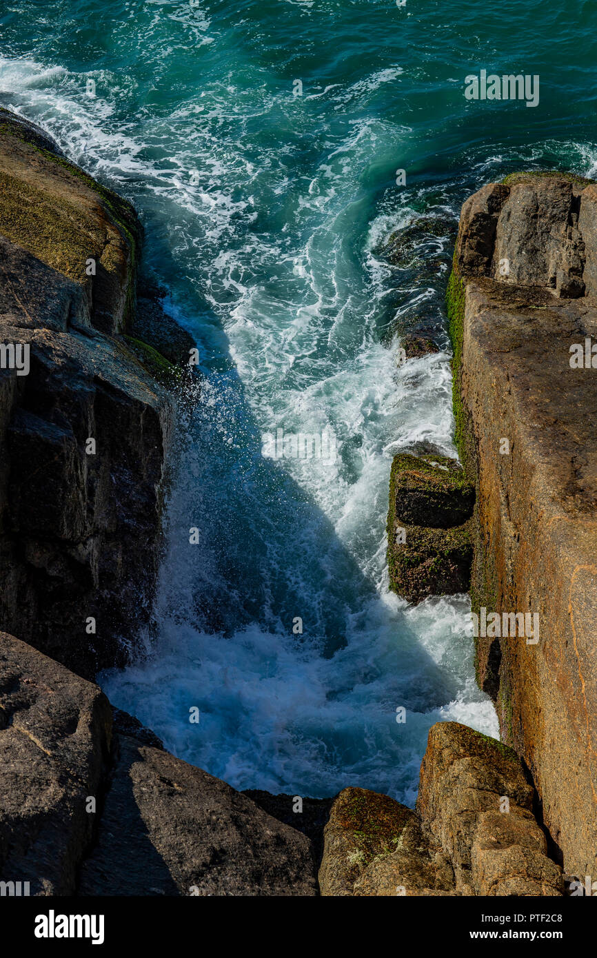 Sea waves breaking on a rocks in Brazil. Deep blue sea waves hit cliff ...
