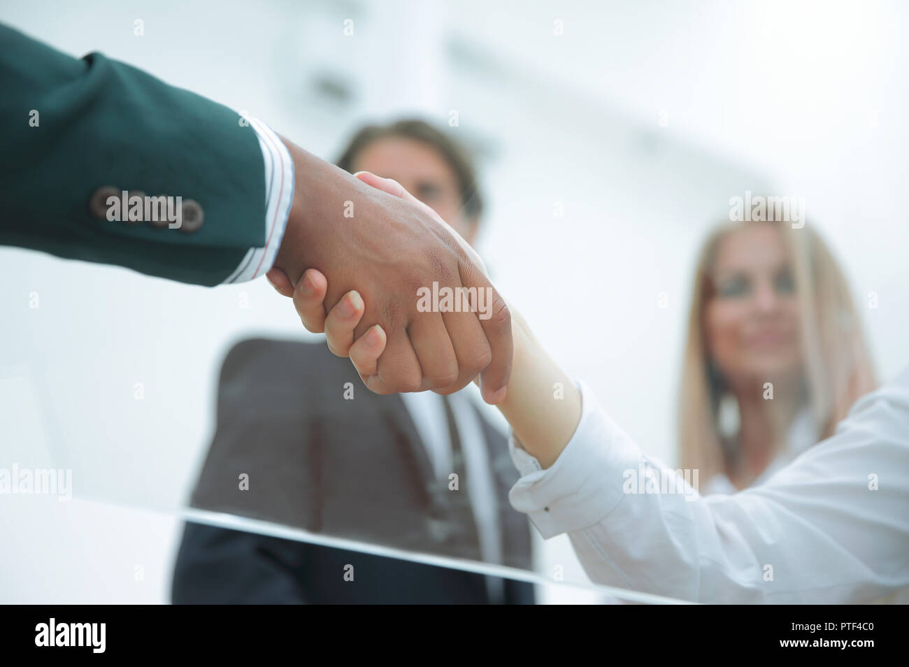 bottom view .handshake business women with a business partner Stock ...
