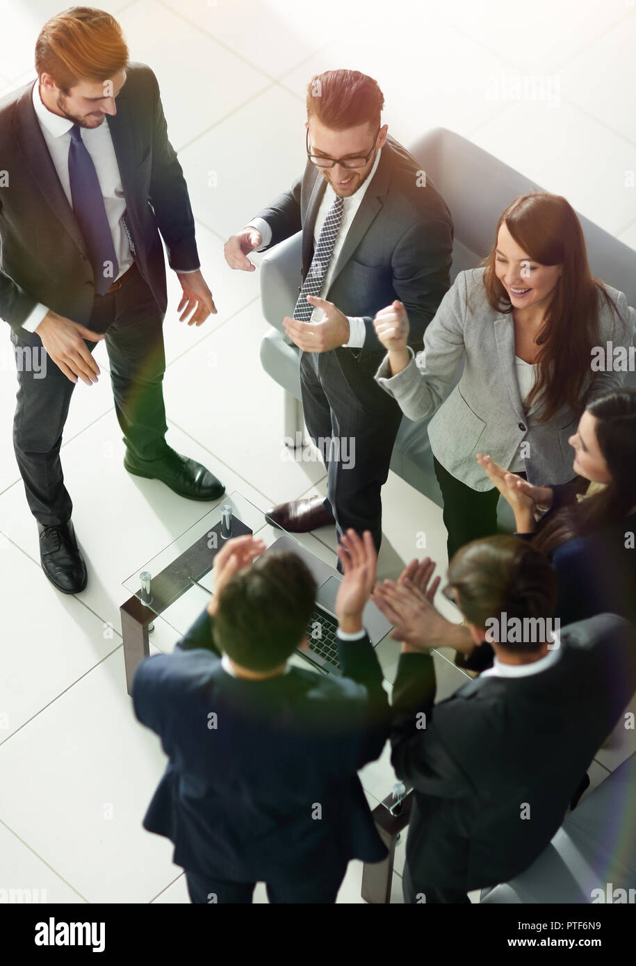 Positive colleagues giving high five Stock Photo - Alamy