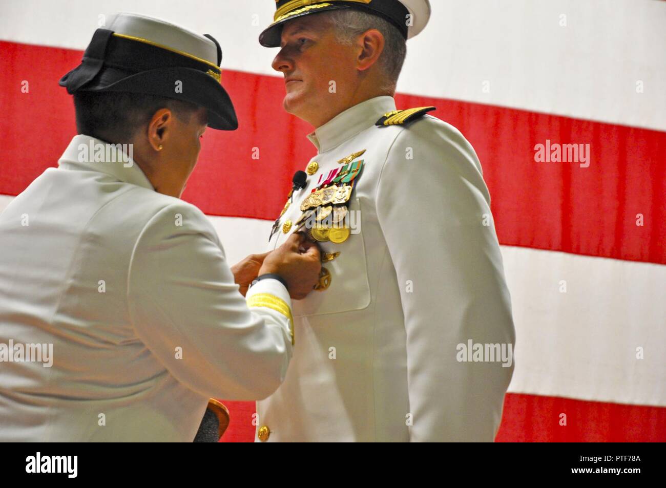 Rear Adm. Bette Bolivar, Commander, Navy Region Southeast, pins the ...
