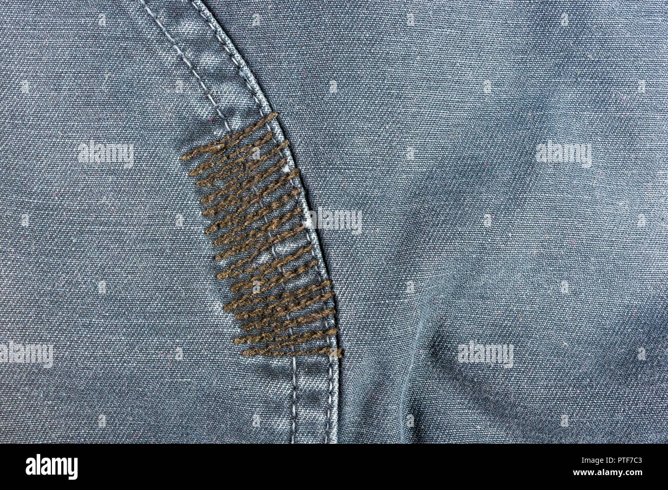 clothing items washed cotton fabric texture with seams, macro, close-up ...