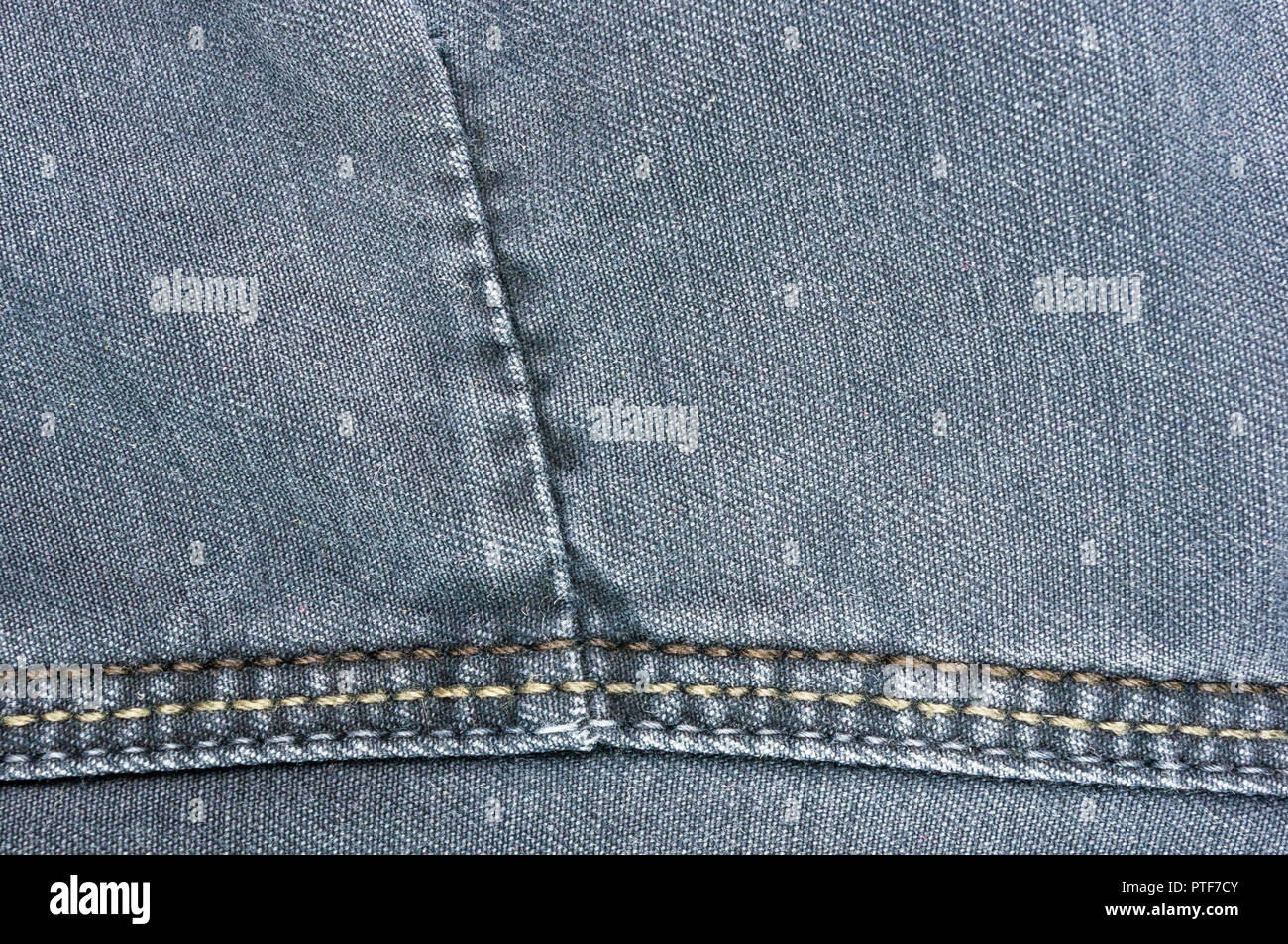 clothing items washed cotton fabric texture with seams, macro, close-up ...