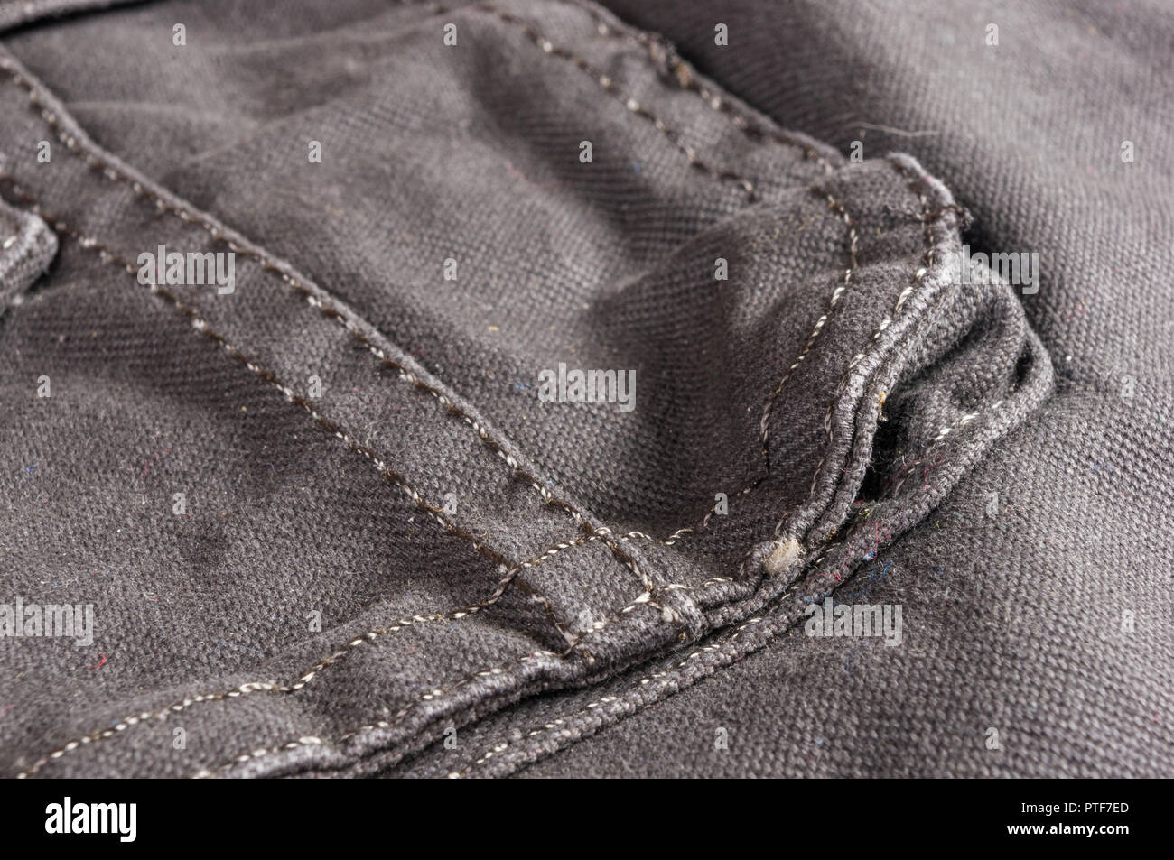 clothing items washed cotton fabric texture with seams, macro, close-up ...