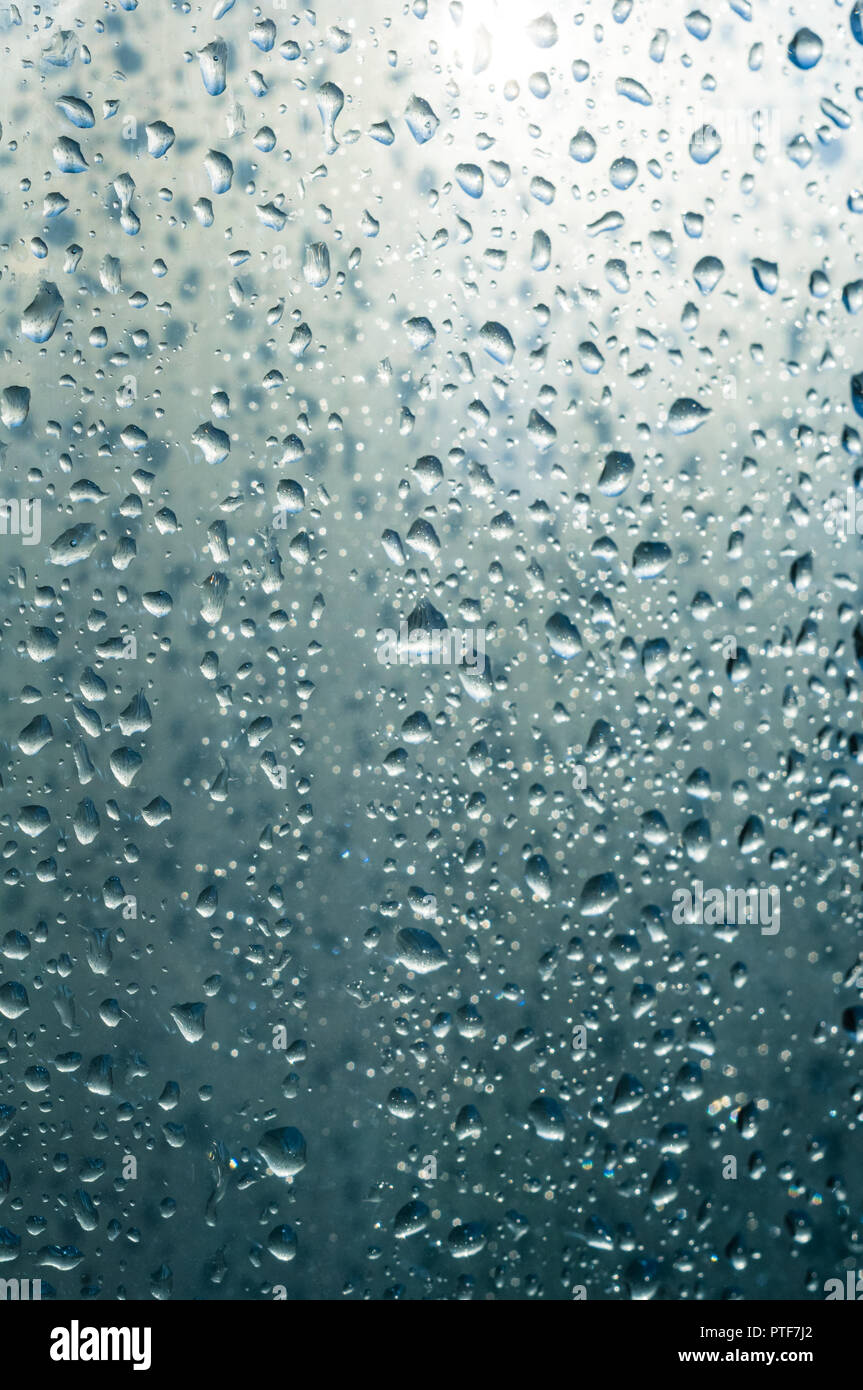 background of raindrops on window glass, toned, close-up Stock Photo ...